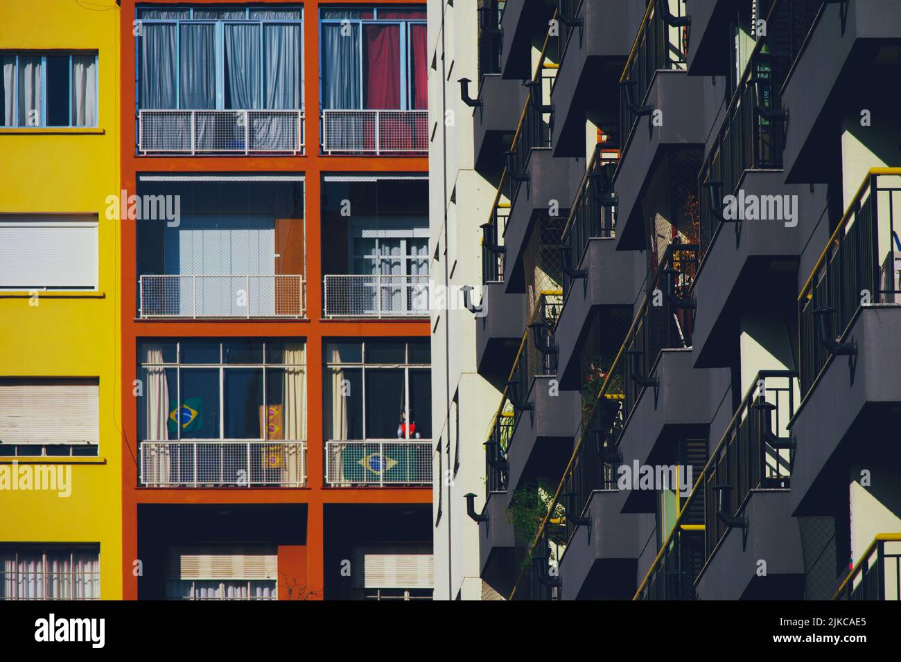 A close-up shot of two modern buildings in contrast colors, with ...
