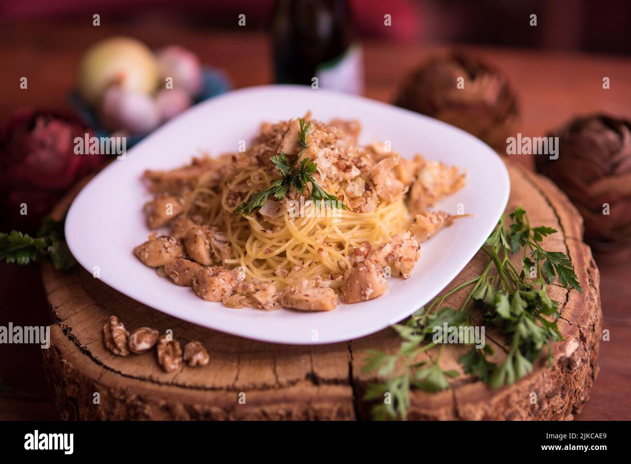 A healthy meal with meat served in a fancy restaurant on a cut tree ...