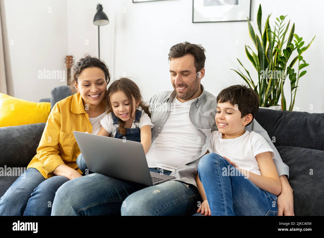 Parents watching kids on internet hi-res stock photography and images ...