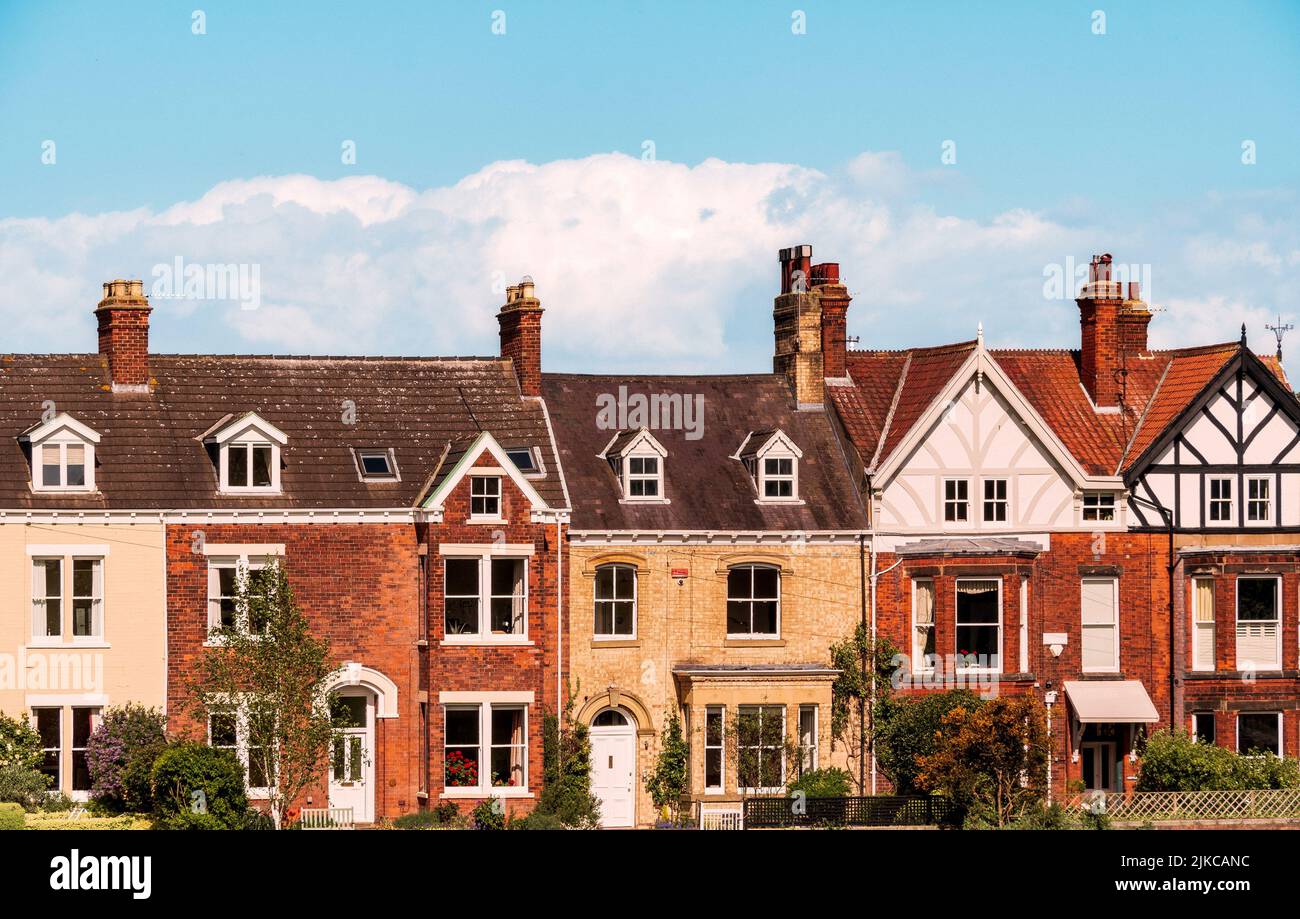 A beautiful shot of old brick houses in a row on a sunny day in England ...