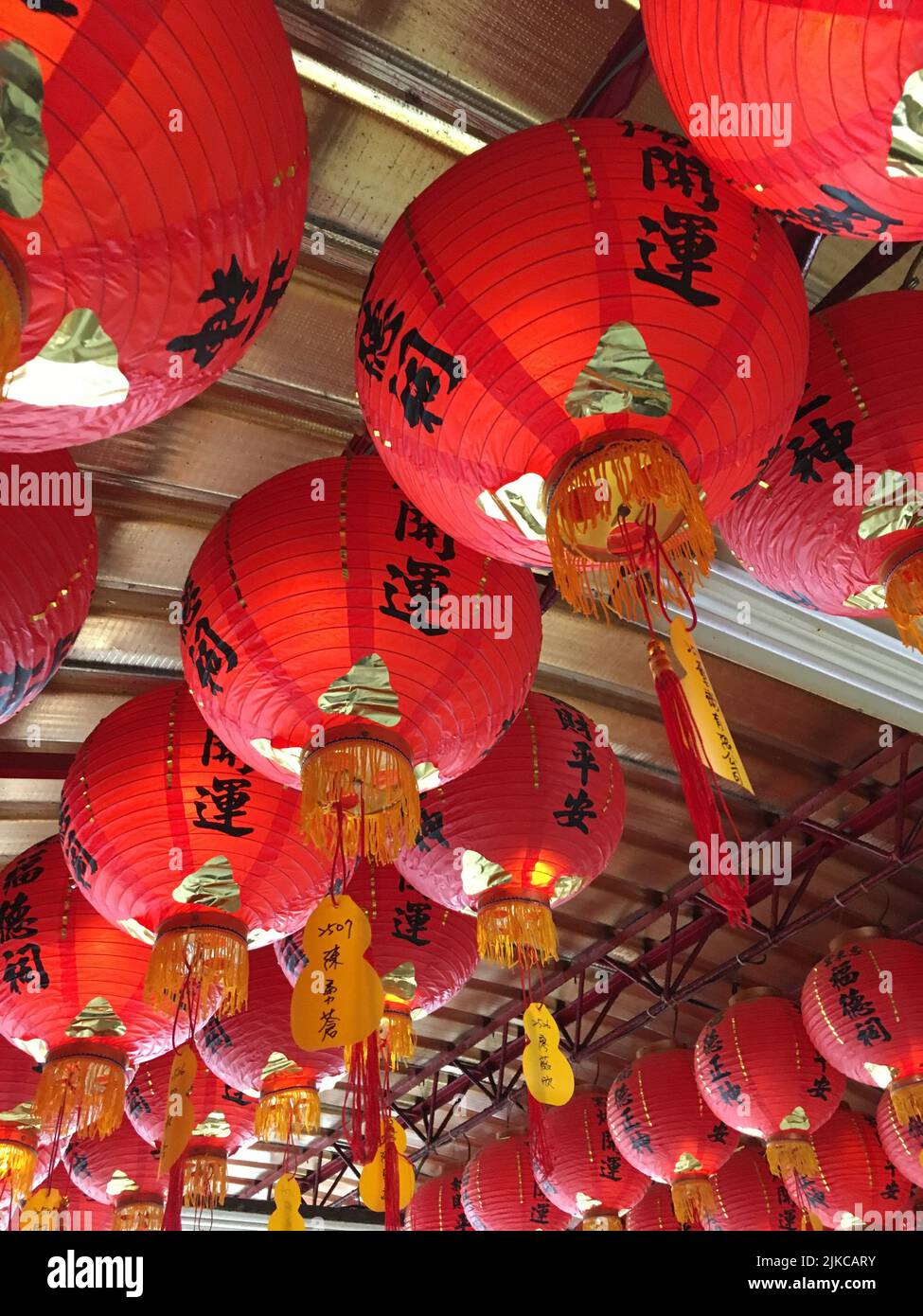 A low angle shot of red Chinese traditional lanterns hanging from a ...