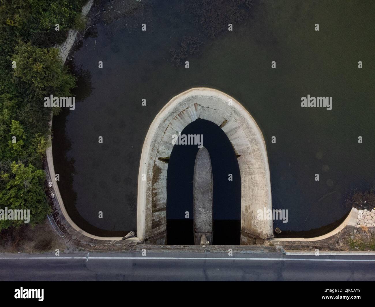 An aerial view of a small concrete arch dam on the lake Stock Photo - Alamy