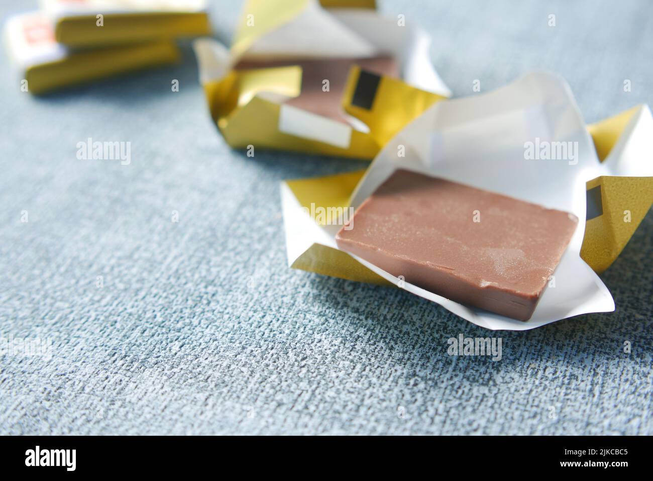 dark chocolate in a paper packet on table Stock Photo - Alamy