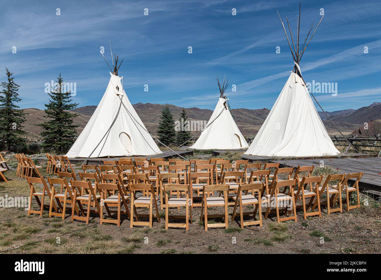 The ceremonial teepees serve as a backdrop for a wedding in Mackay ...