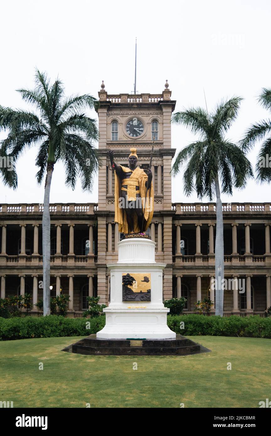 A vertical shot of an ancient statue in front of a building Stock Photo ...
