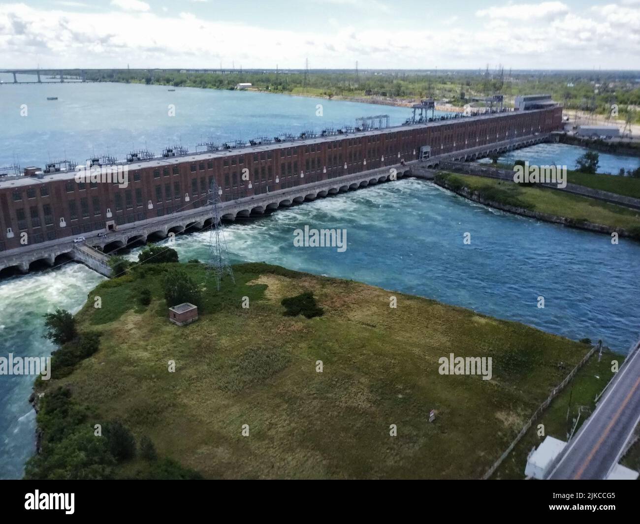 A dam on top of the water connected to small fields with a bridge Stock ...