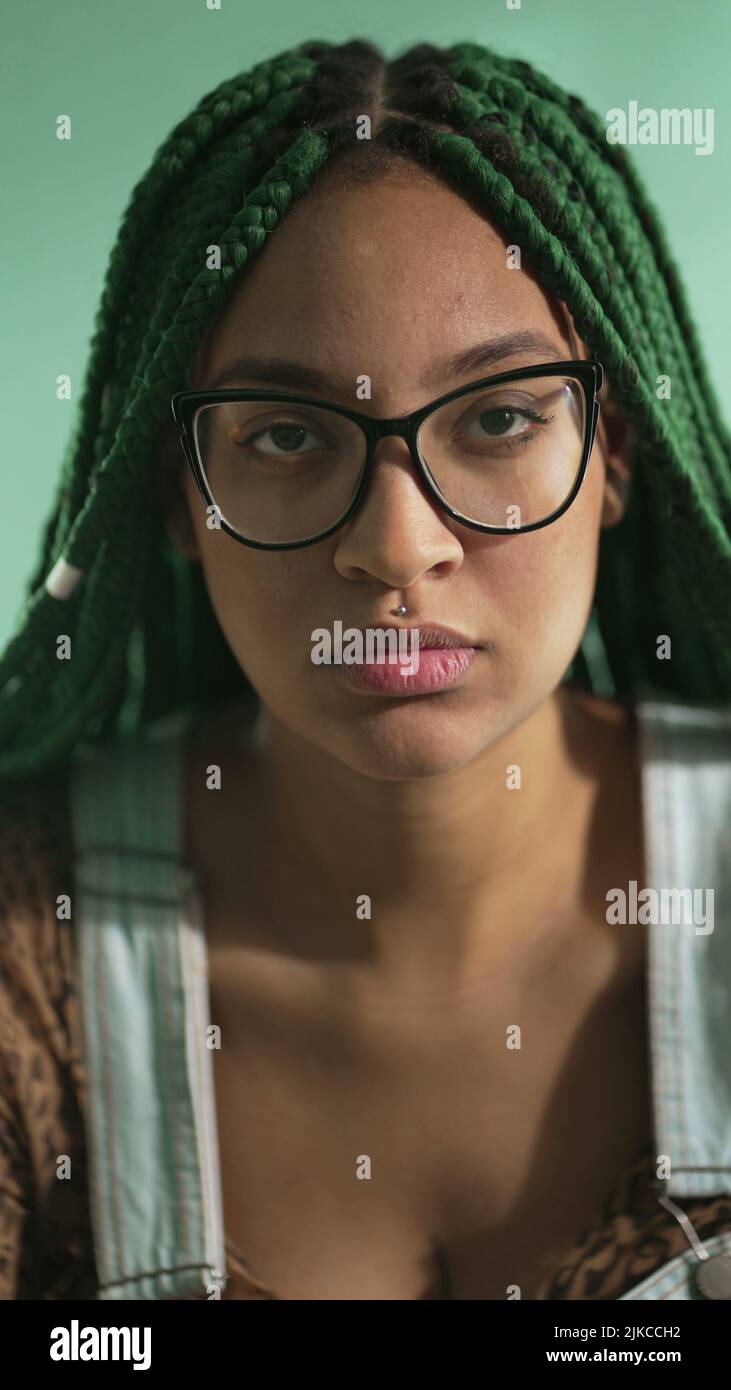 Portrait of a hispanic latina black girl with green dreadlocks box ...