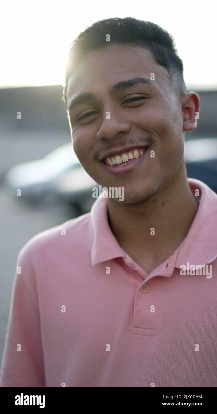 Portrait of a happy hispanic south american young man laughing and ...