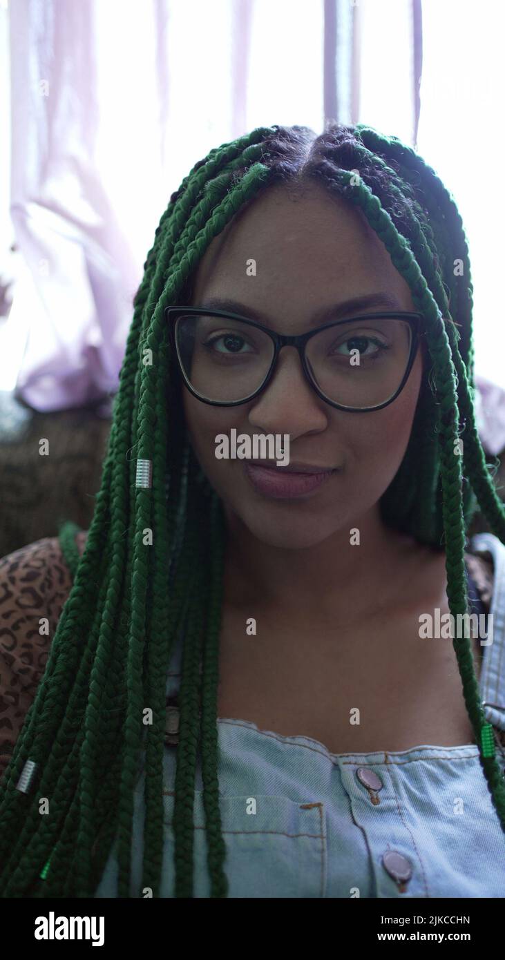 Portrait of a young hispanic black woman with Box Braid hairstyle ...