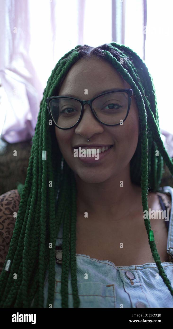 Portrait of a young hispanic black woman with Box Braid hairstyle ...