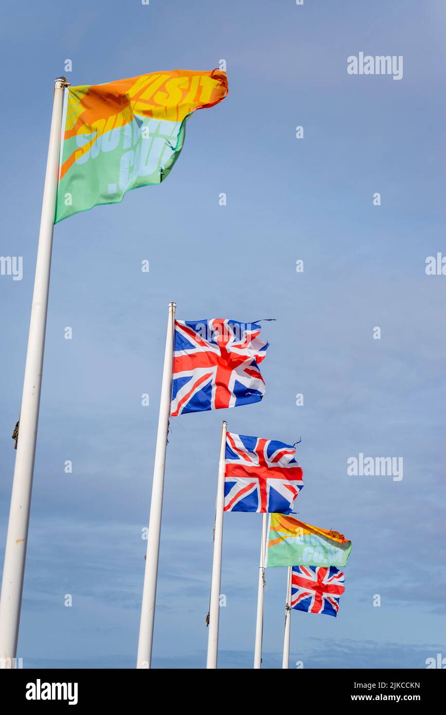 Visit Southend and Union Jack flags flying in strong wind on Western ...