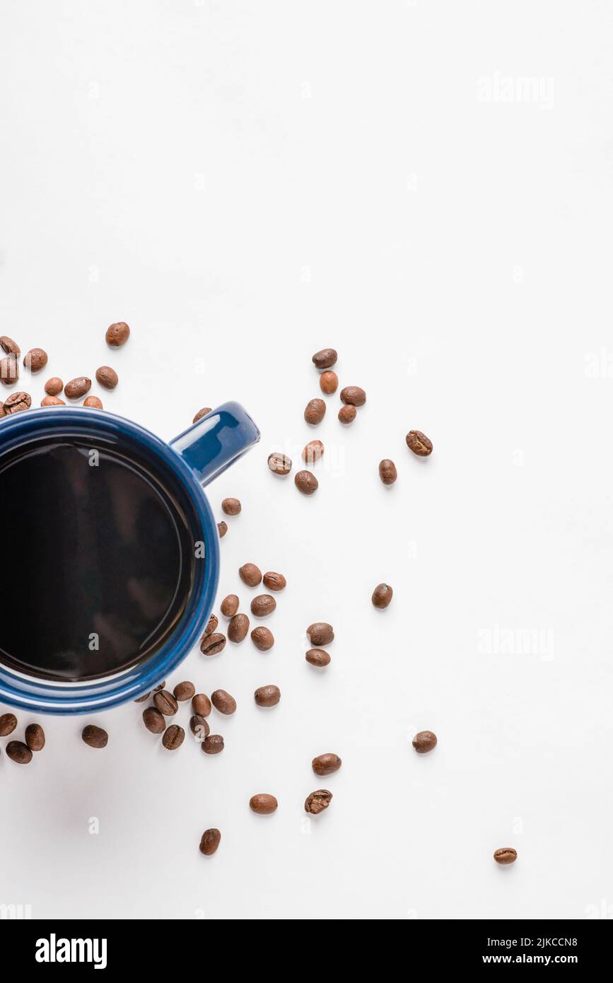A vertical shot of a cup of black coffee on white background with ...