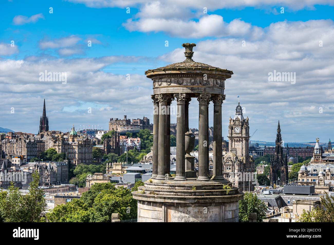 Iconic view of Dugald Stewart Monument over city skyline with Edinburgh ...