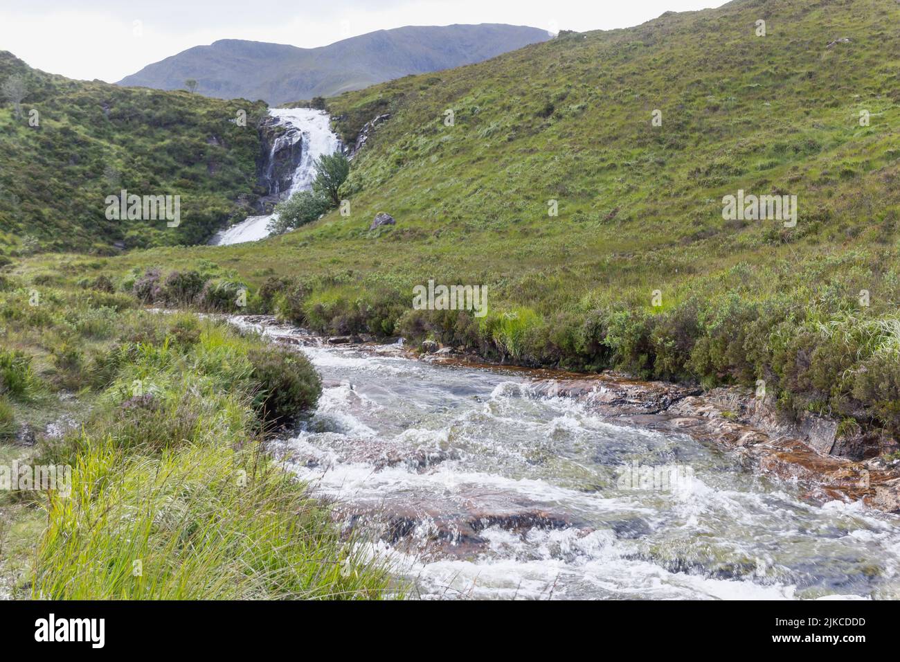 A gorgeous, clean mountain river coming from mountain peak of Isle of ...