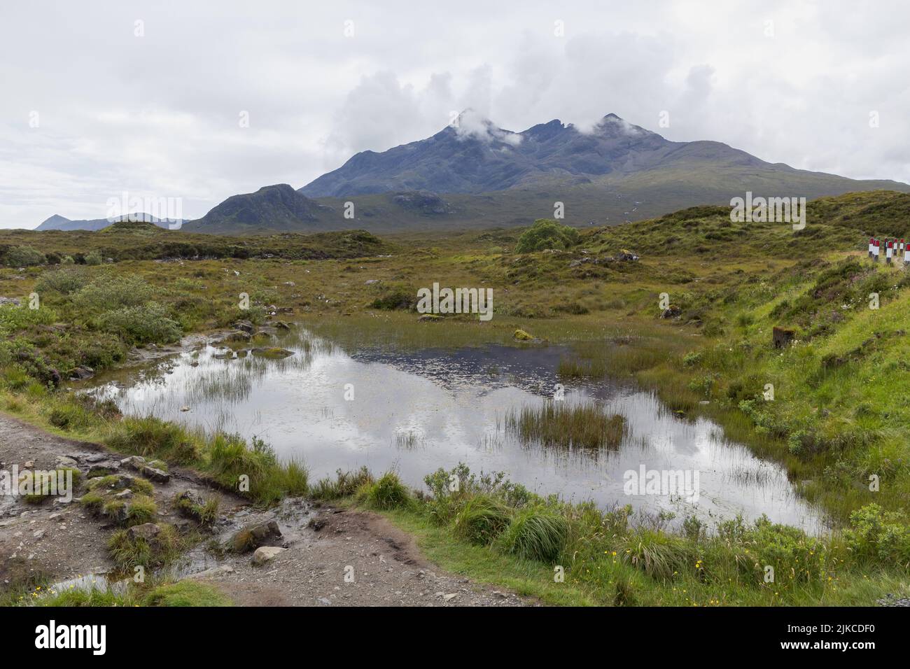 A gorgeous lake near the high mountains peak, Isle of Skye, Scotland ...