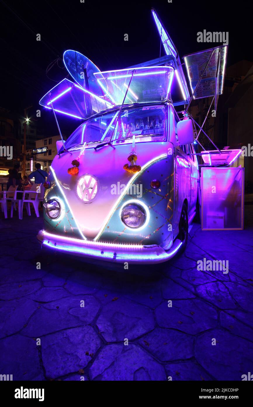 A vertical shot of a Volkswagen bus converted into a bar, decorated ...