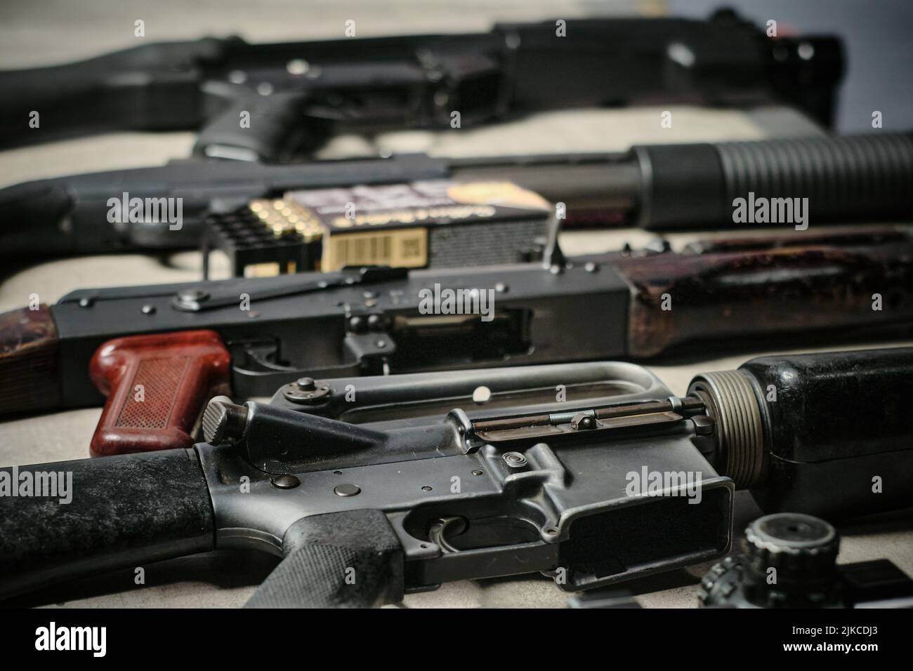 The set of different guns on the table Stock Photo - Alamy