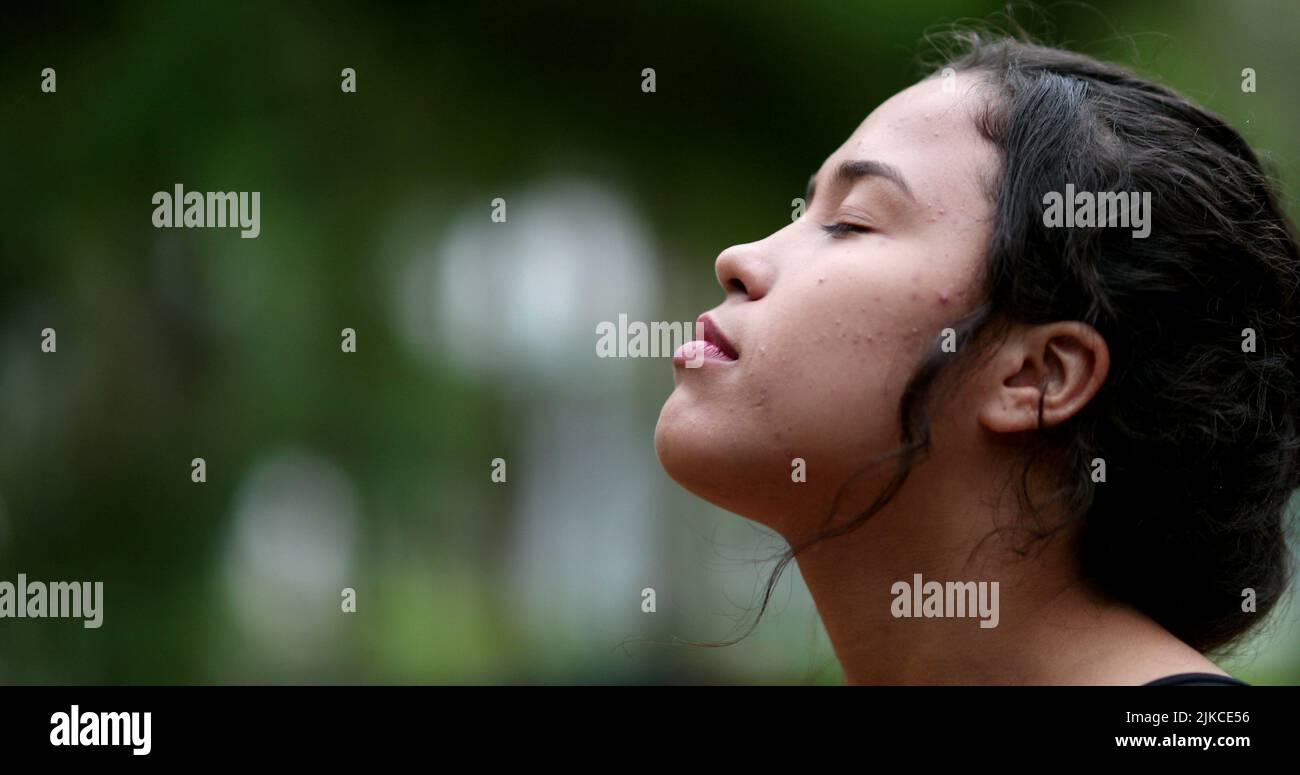 Meditative profile girl opening eyes and smiling, contemplative woman ...
