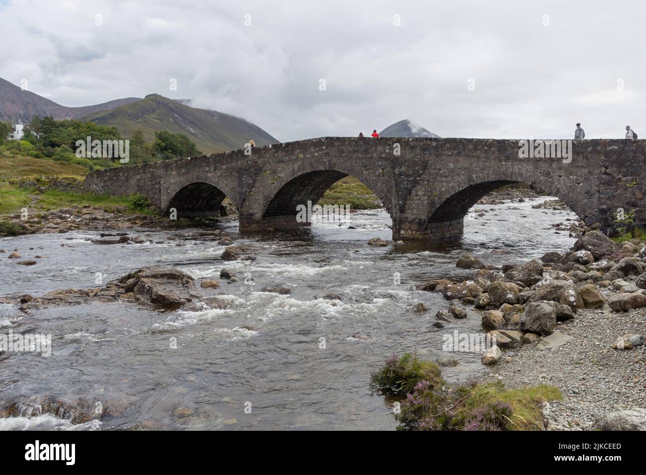 An old, stone bridge on a mountain river in the Isle of Skye, Scotland ...