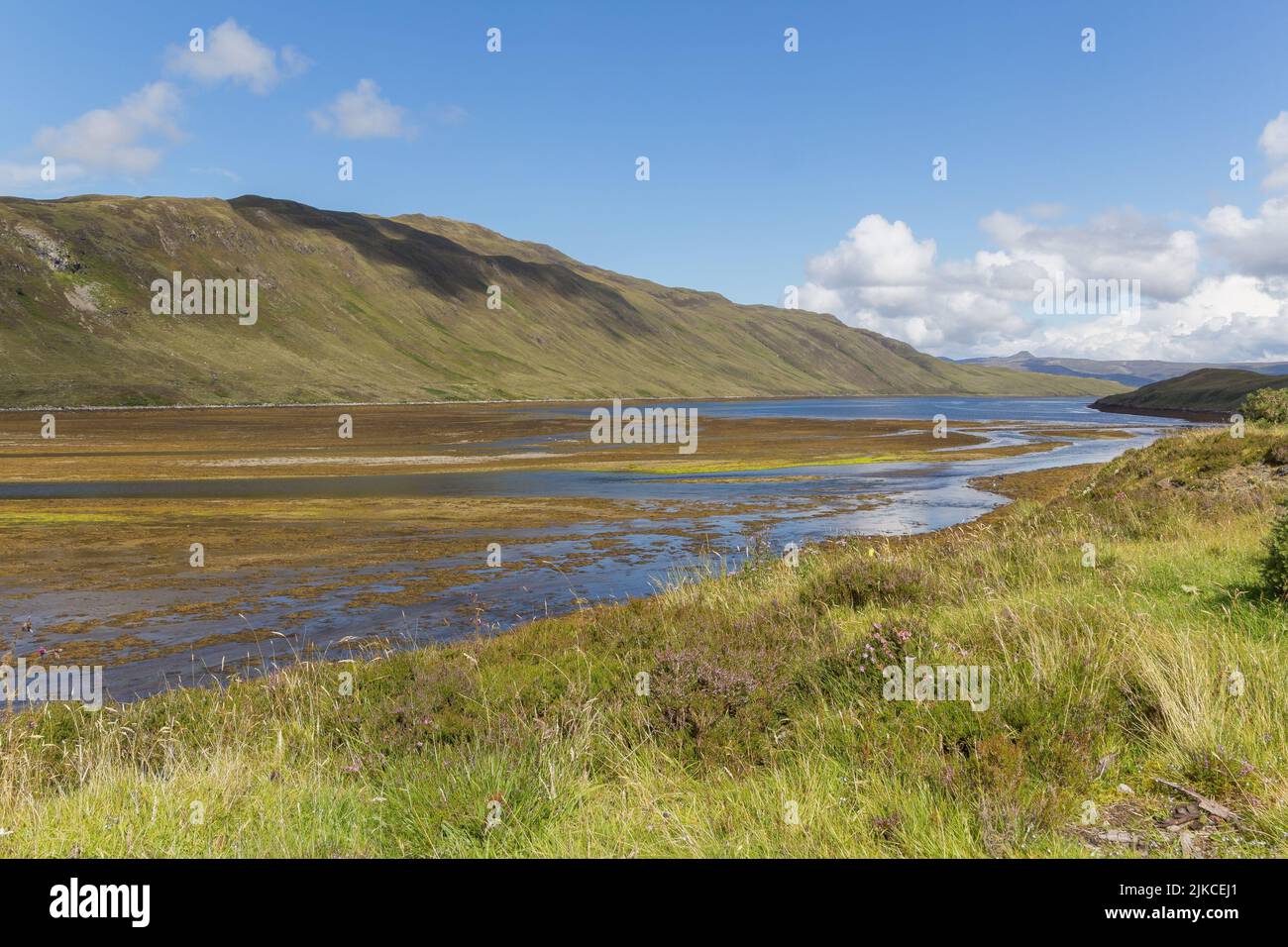 A landscape of shallow lagoon with fields and sea, The Isle of Skye ...