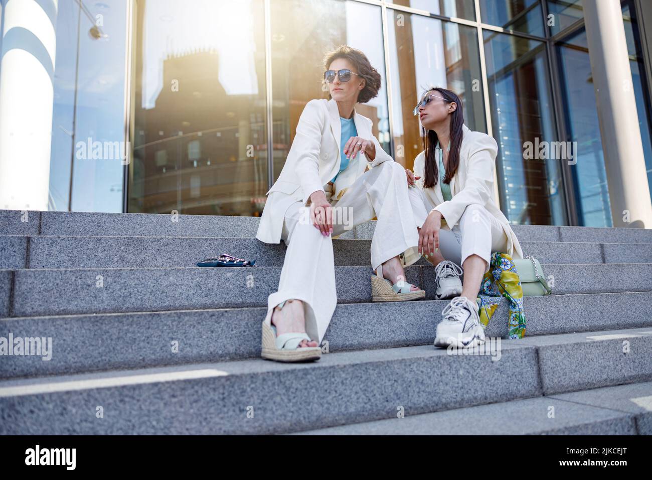 Mobile phone young women coffee stairs hi-res stock photography and ...