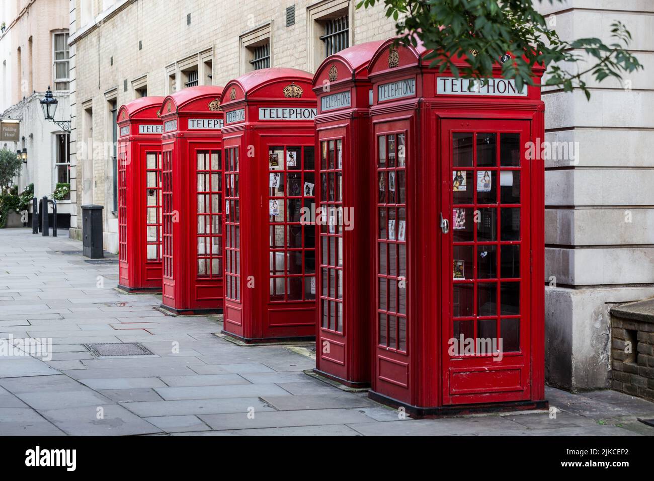 The row of London's iconic red telephone boxes, UK Stock Photo - Alamy