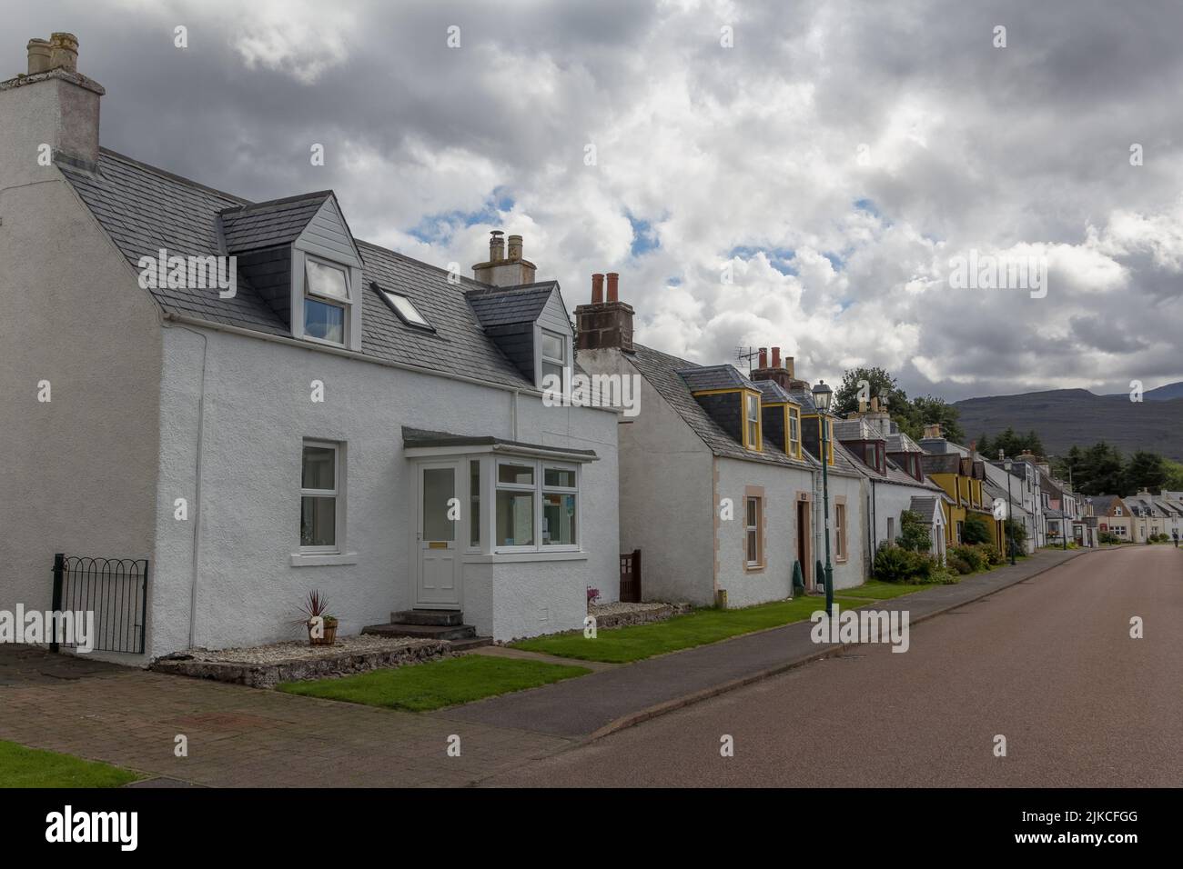 A neighborhood in Scotland with a cloudscape Stock Photo - Alamy