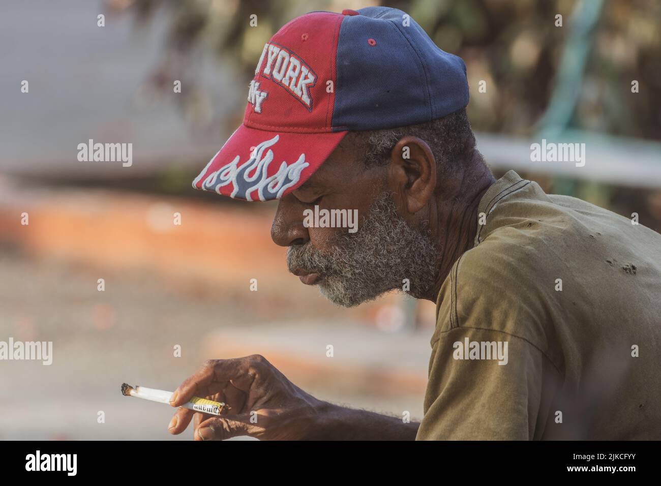 A homeless man smoking a cigarette in Matanzas, Cuba Stock Photo - Alamy