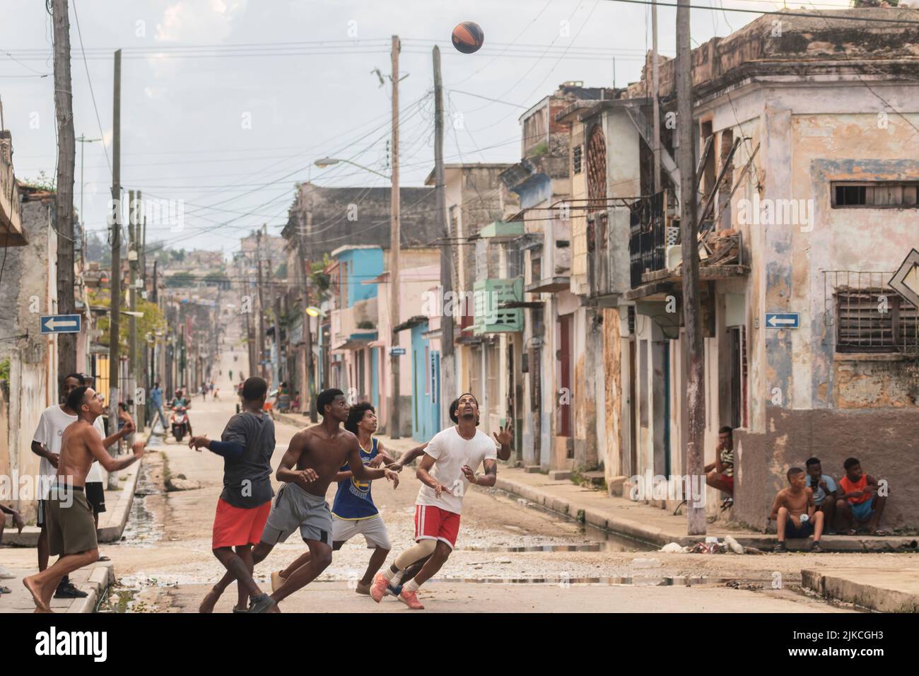 The young boys playing basketball on the street in the Marina ...