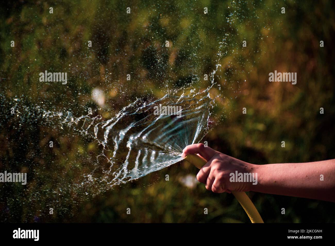 Squirting hose hi-res stock photography and images - Alamy