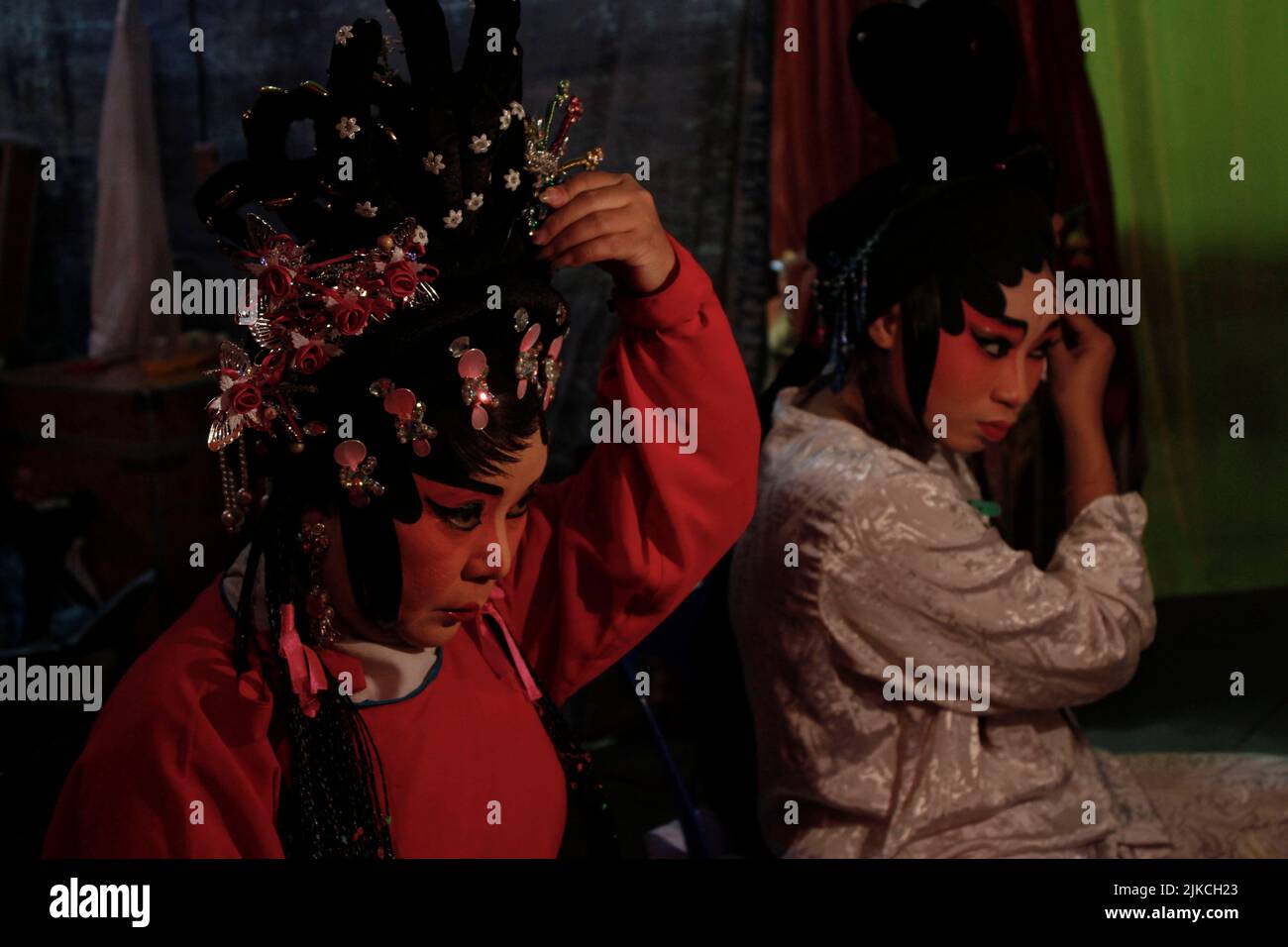 The portrait of female artists fixing their hair before the performance ...