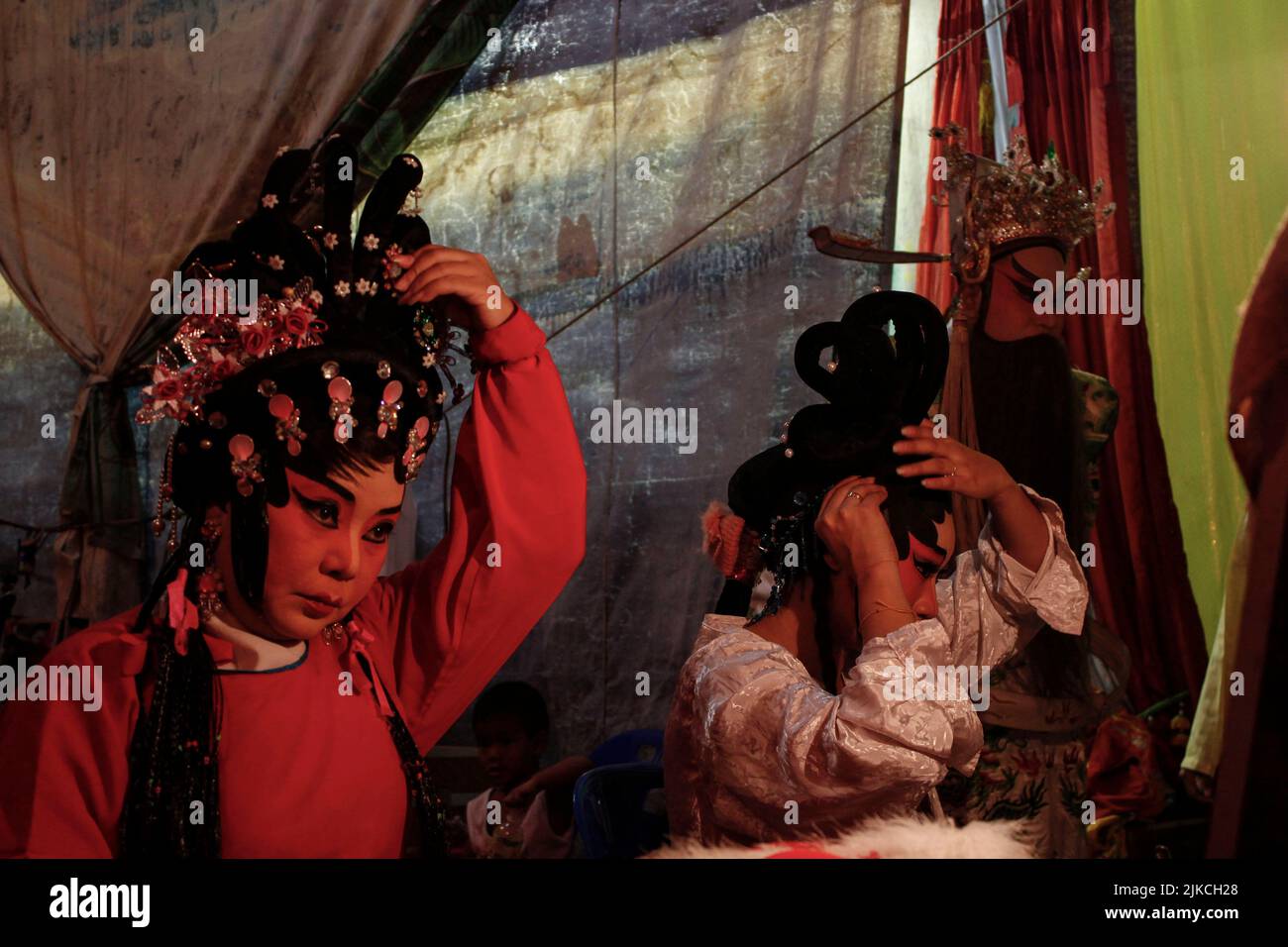 The portrait of female artists fixing their hair before the performance ...