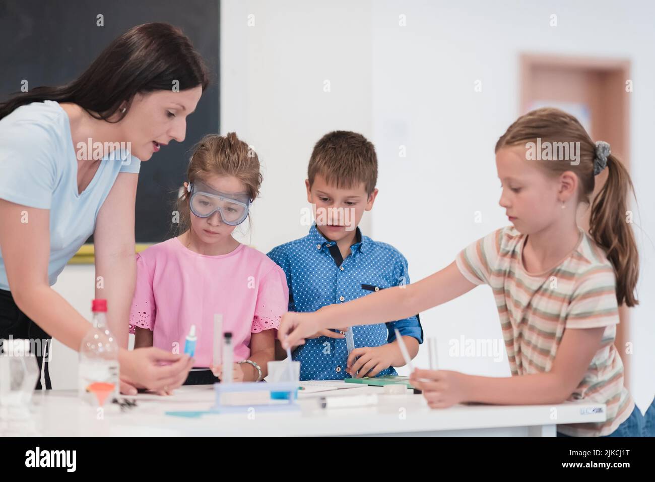 Elementary School Science Classroom: Enthusiastic Teacher Explains ...