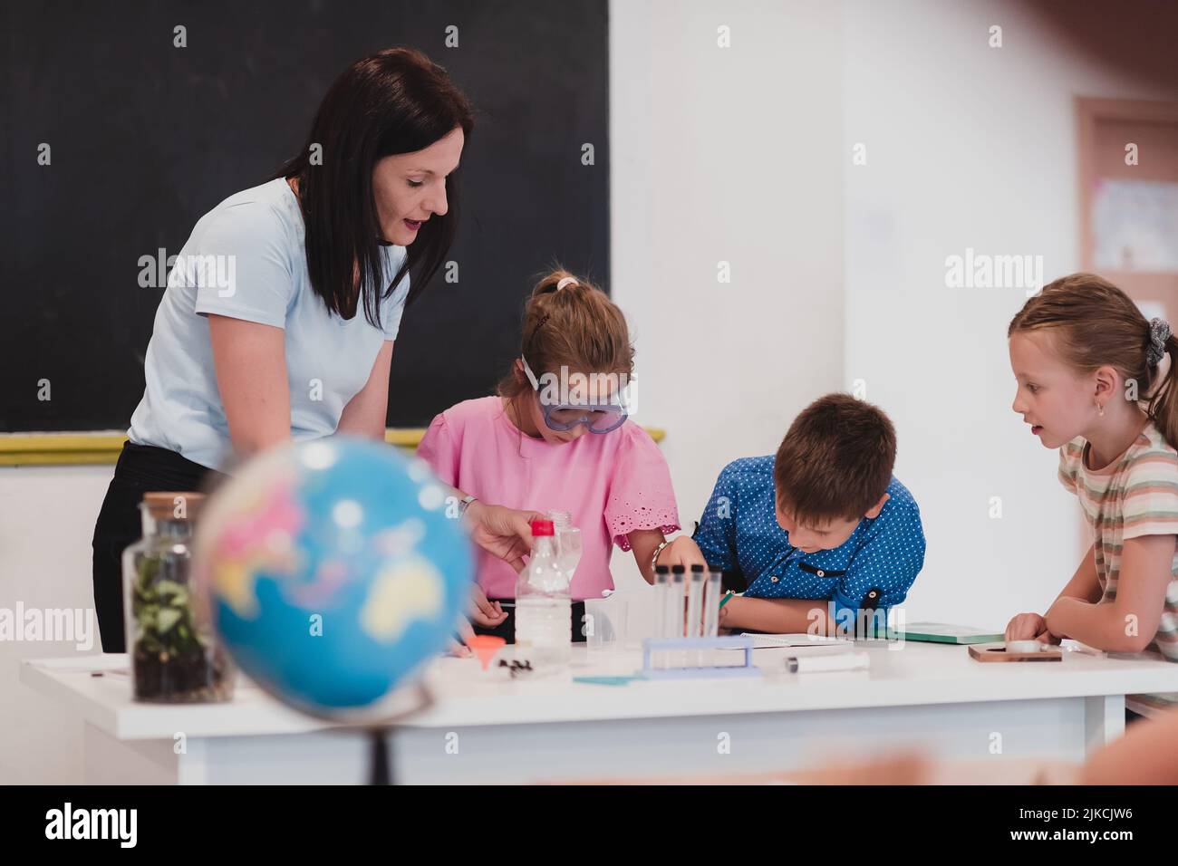 Elementary School Science Classroom: Enthusiastic Teacher Explains ...