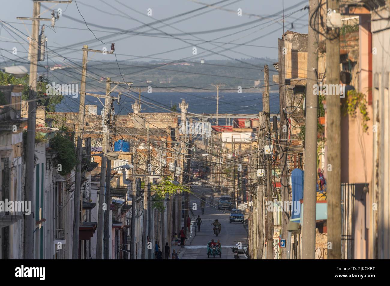 A vertical shot of poor streets with of Matanzas dense old buildings ...