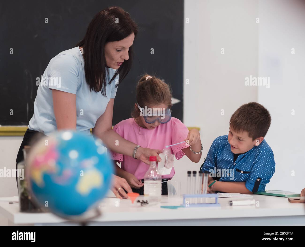 Elementary School Science Classroom: Enthusiastic Teacher Explains ...