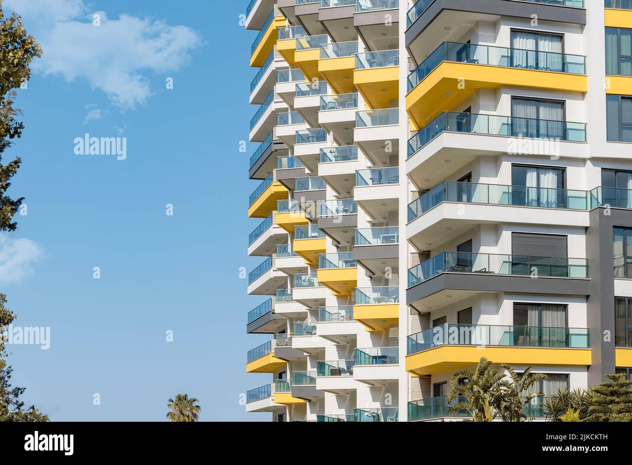 Facade of a sunlit modern apartment building in Alanya, Turkey Stock ...