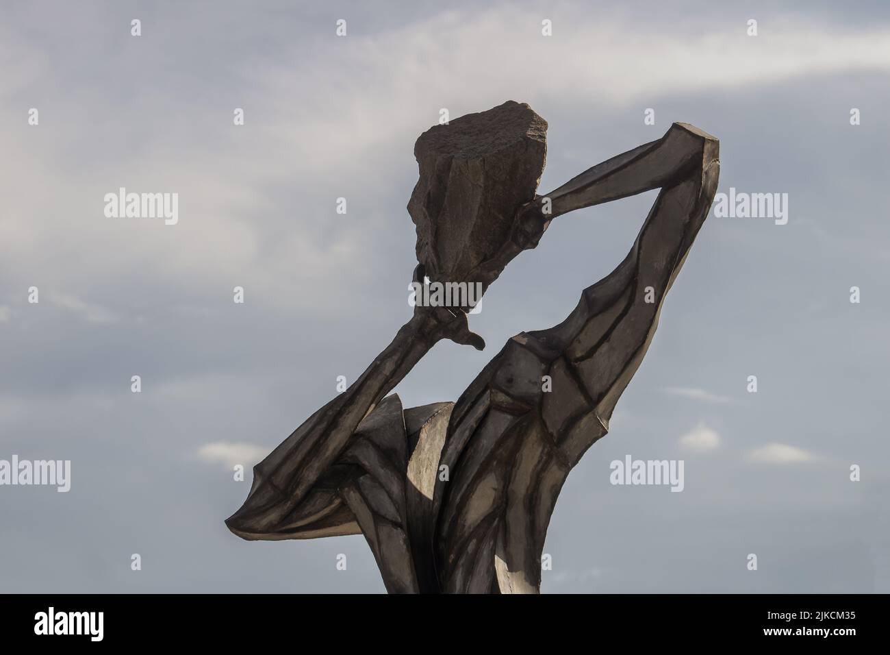 A sculpture with a stone head separated from the body Stock Photo - Alamy