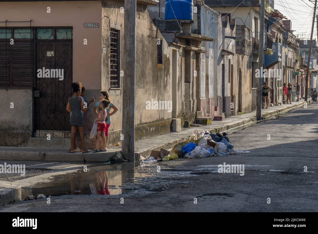 Children playing in a corner of a street Stock Photo - Alamy