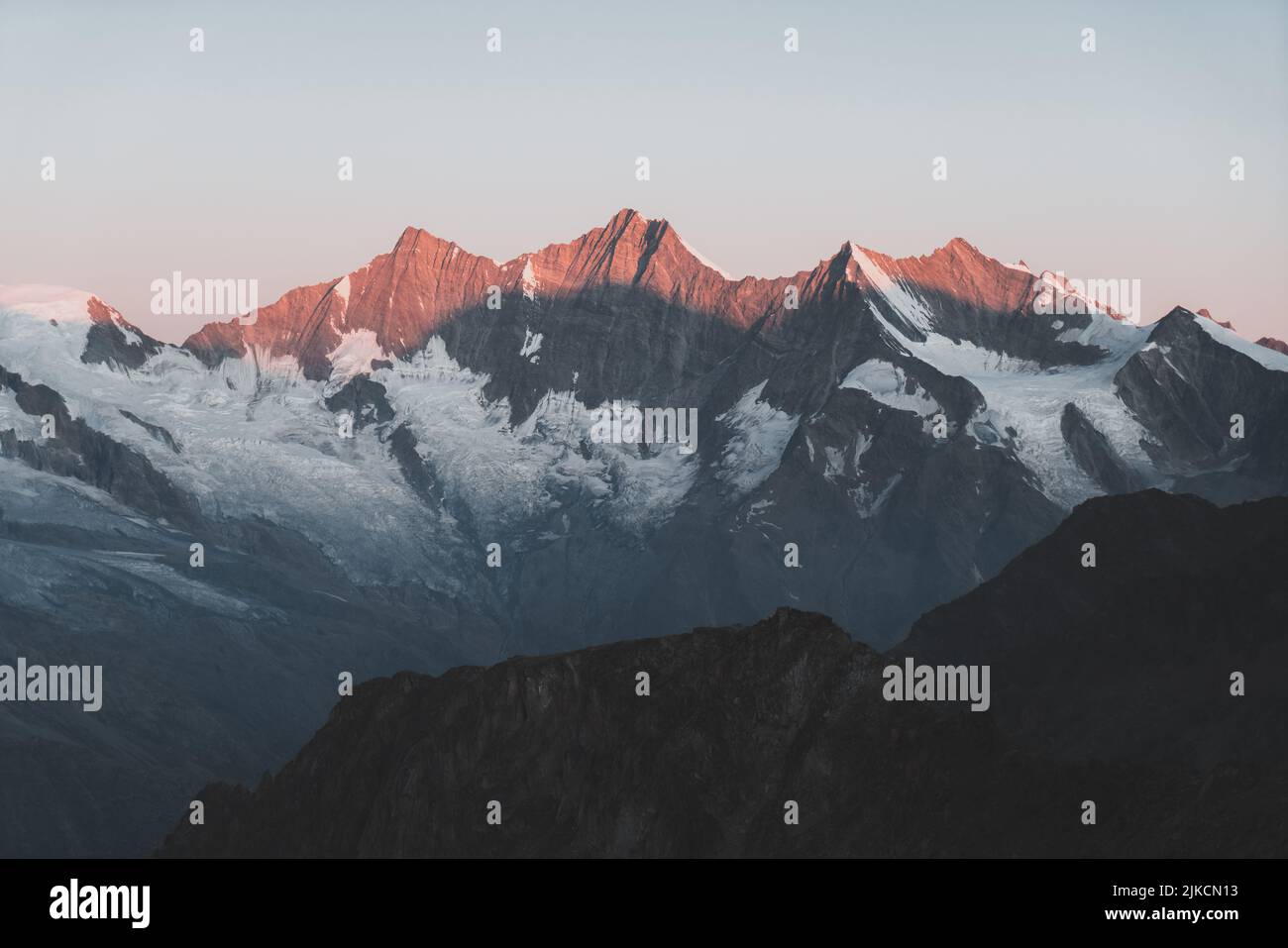 Sun hitting snowy peaks hi-res stock photography and images - Alamy