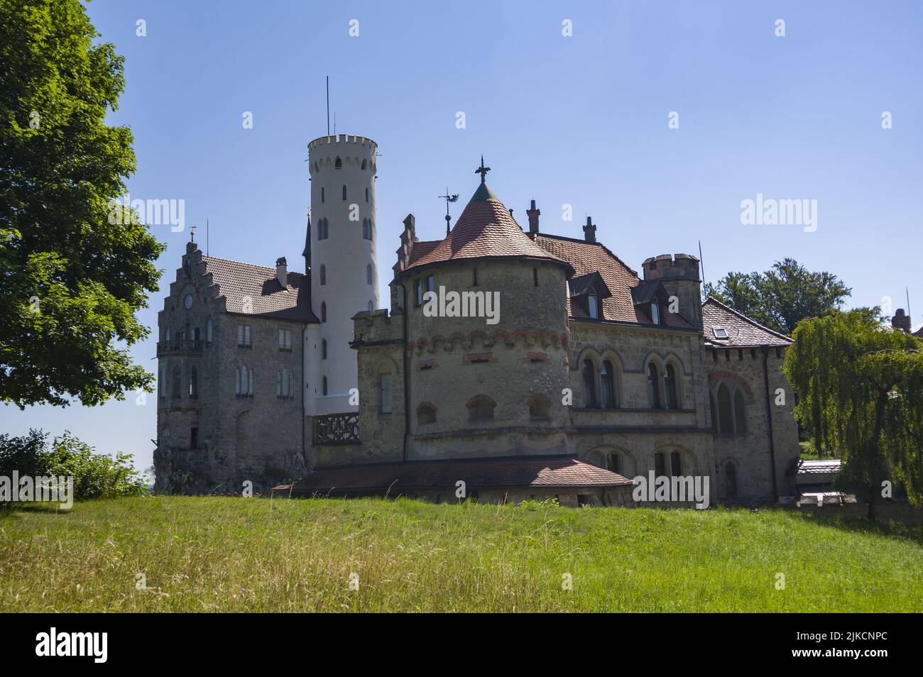 Photo of lichtenstein castle or Schloss on forested rock cliff in ...