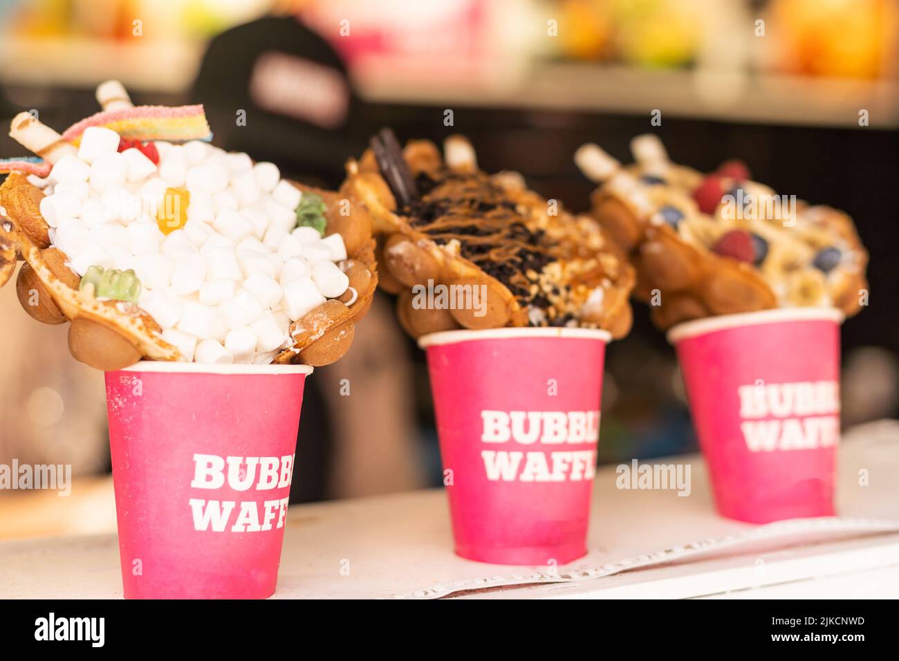 Hong Kong style egg waffles, ice cream and caramel syrup. Trendy food ...