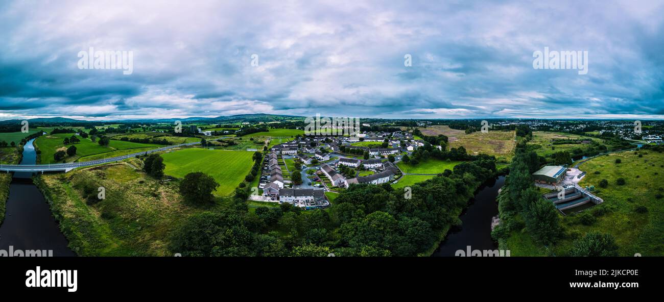 A breathtaking panoramic nature landscape with houses in Omagh, Ireland ...