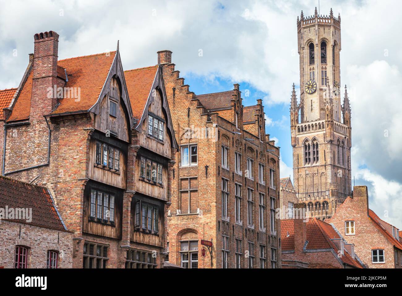 Bruges belfry tower, above flemish architecture buildings, Belgium ...