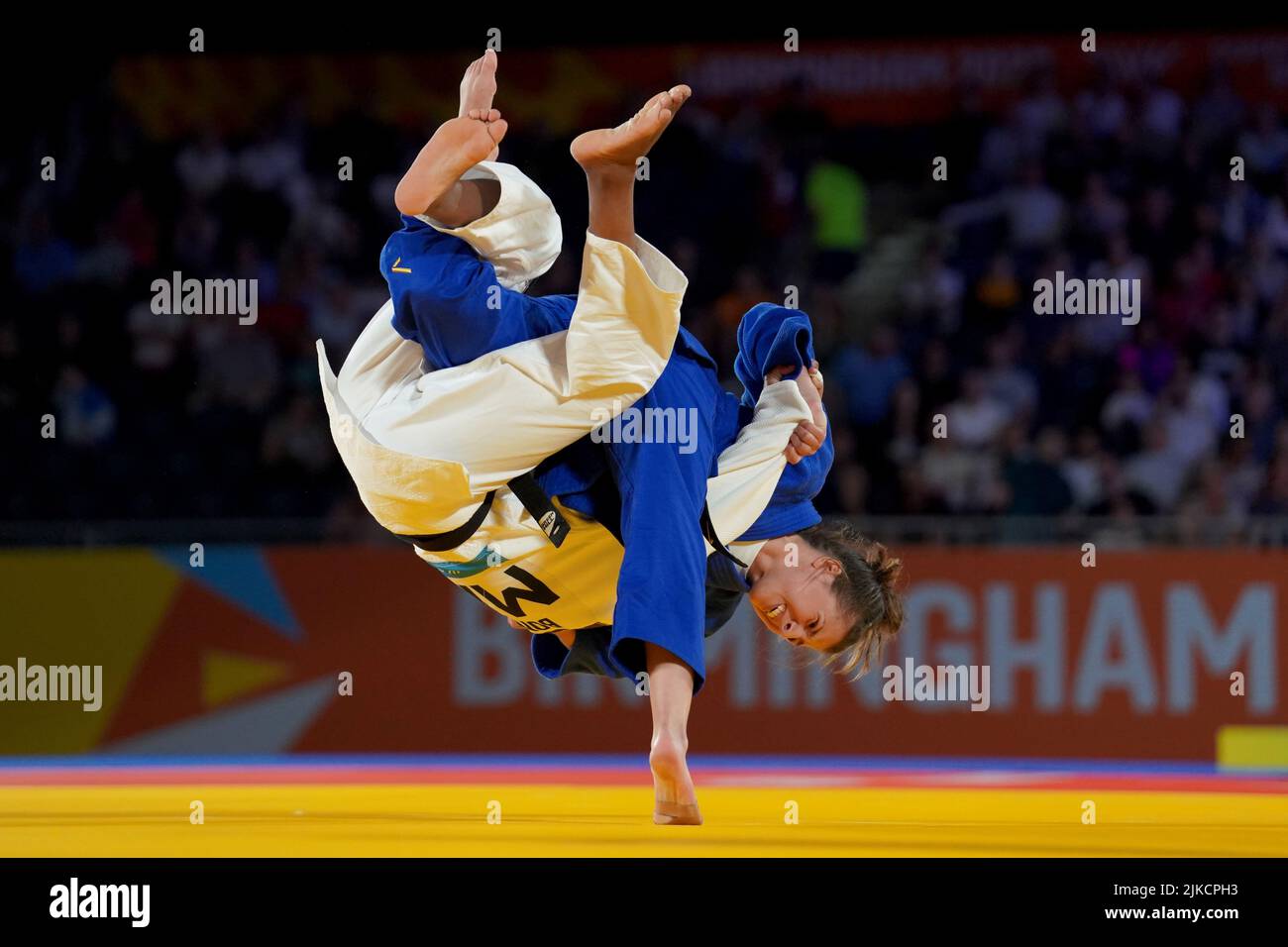 England’s Amy Platten (blue) and Malawi’s Harriet Bonface in action ...