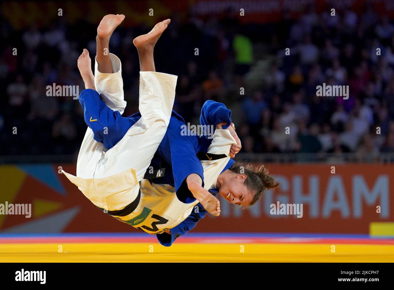 England’s Amy Platten (blue) and Malawi’s Harriet Bonface in action ...