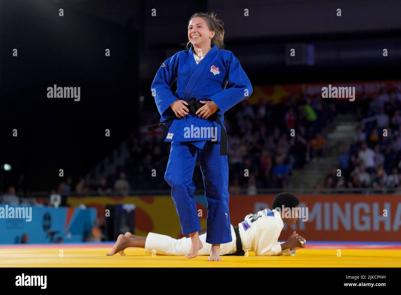 England’s Amy Platten (blue) celebrates after defeating Malawi’s ...