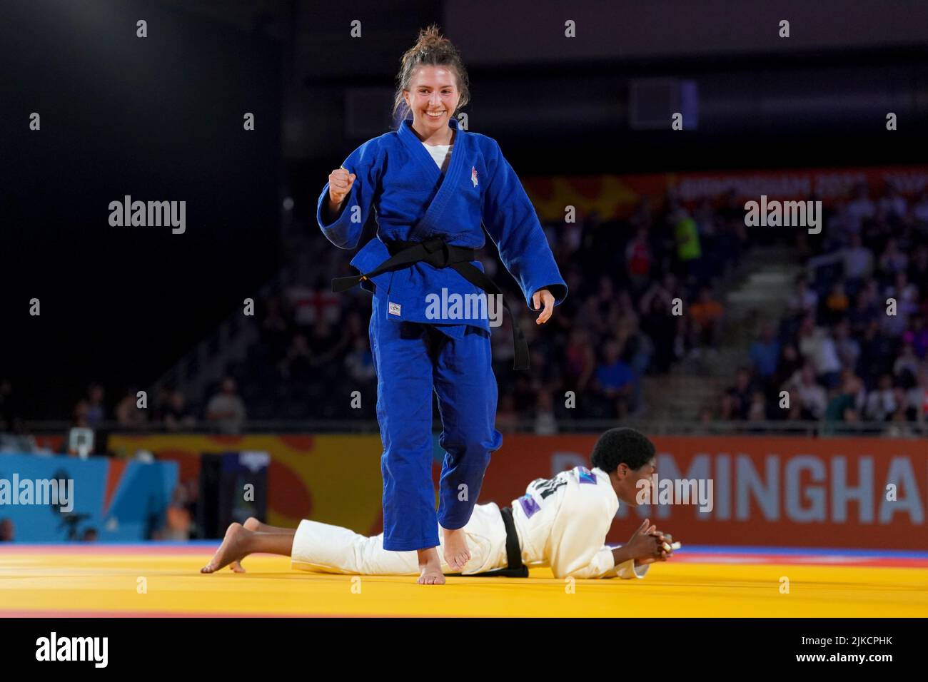 England’s Amy Platten (blue) celebrates after defeating Malawi’s ...