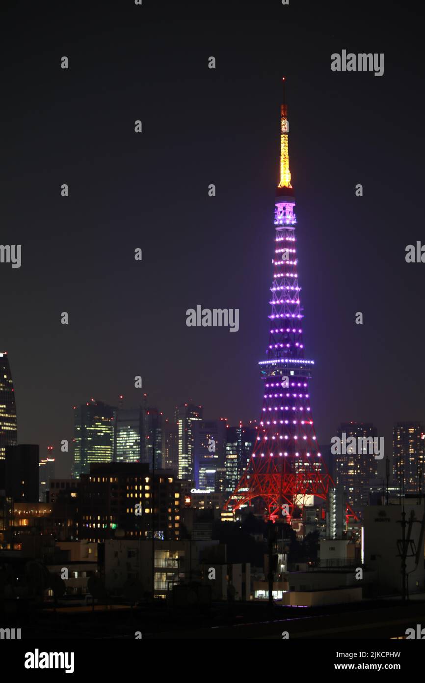 A vertical shot of the Tokyo Tower illuminated at night in Japan Stock Photo - Alamy
