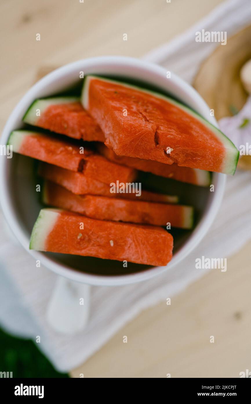 Watermelon slices in a white bowl Stock Photo - Alamy